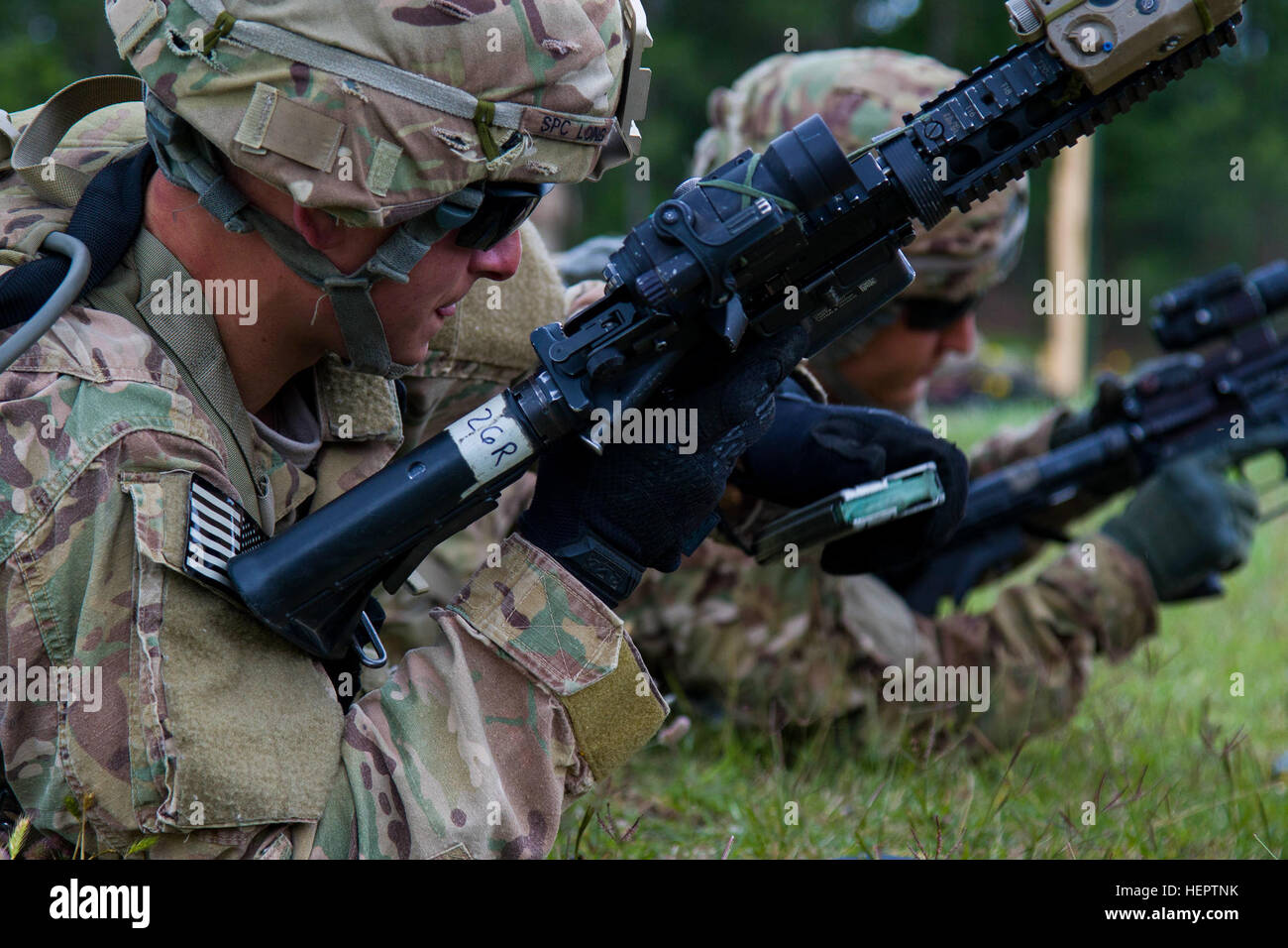 An 82nd Airborne Division Paratrooper reloads his M4 rifle to ...