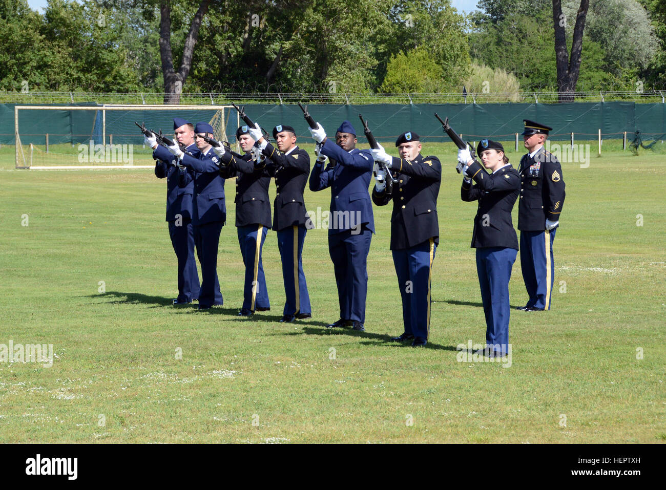 The firing team executing a rifle shooting volley, at the Memorial Day ...