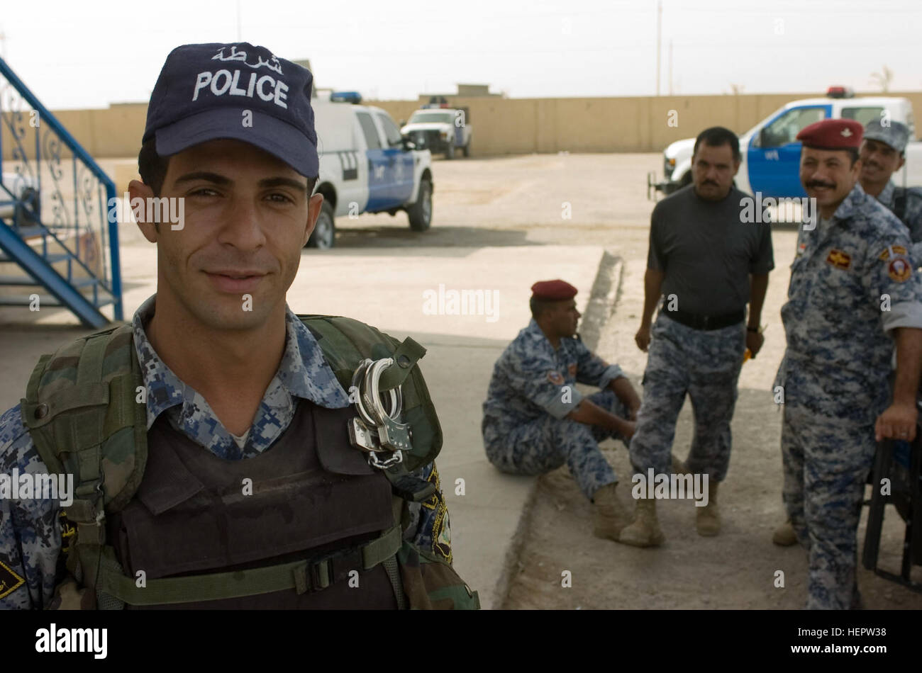 Iraqi police of Special Response Team 3 relax before heading out on a ...