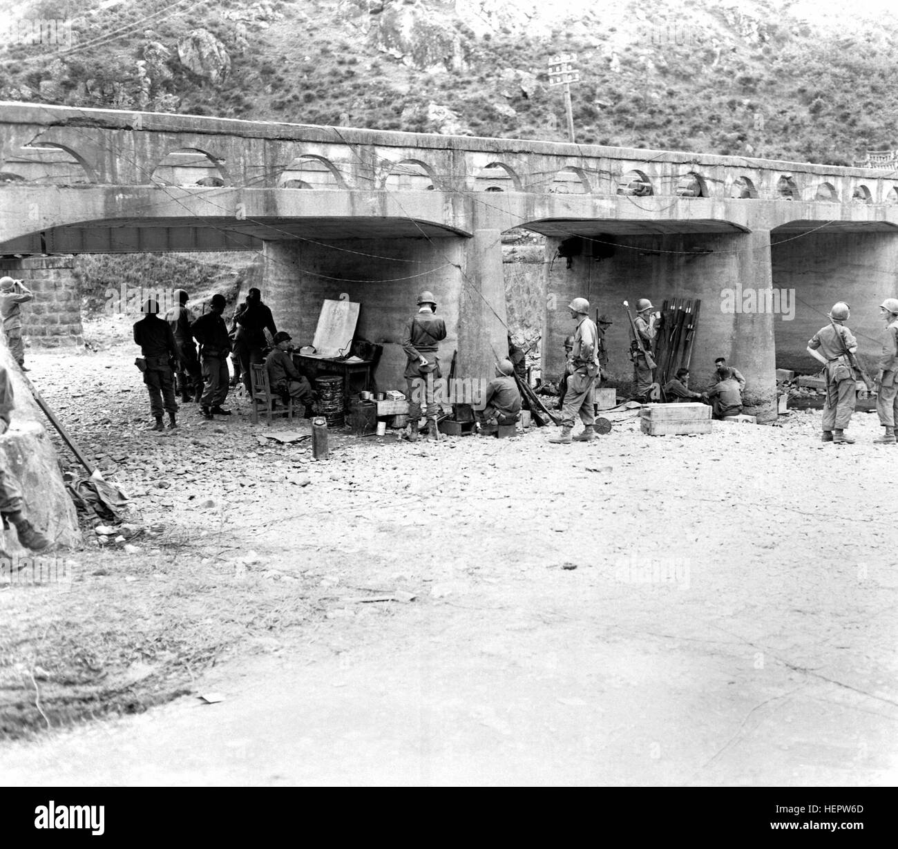 WAR IN KOREA: Men of the 27th Inf Regt set up a CP under a bridge near ...