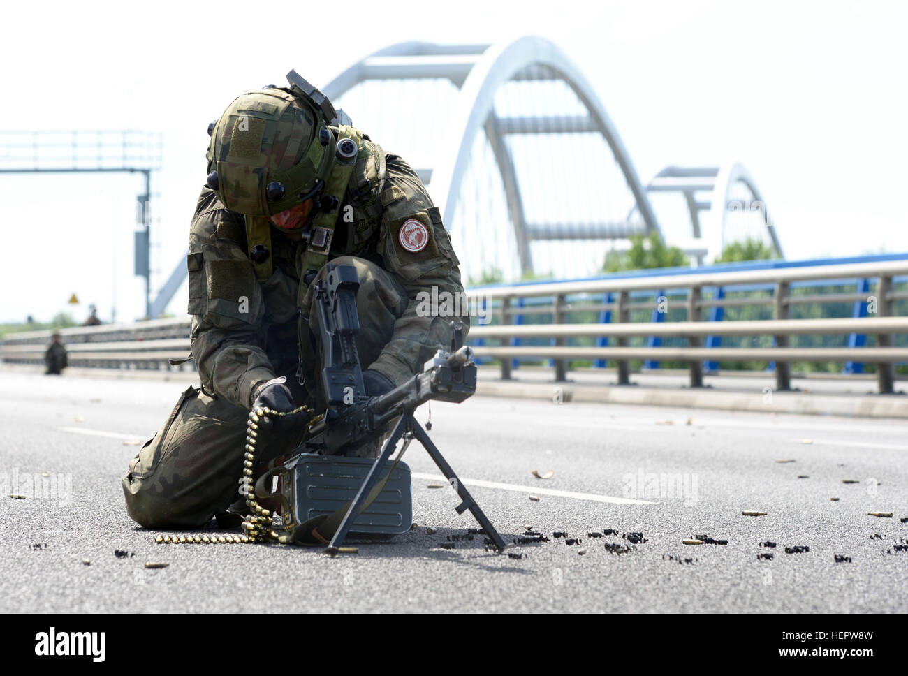 A Polish Soldier reloads his weapon during Exercise Swift Response. The ...