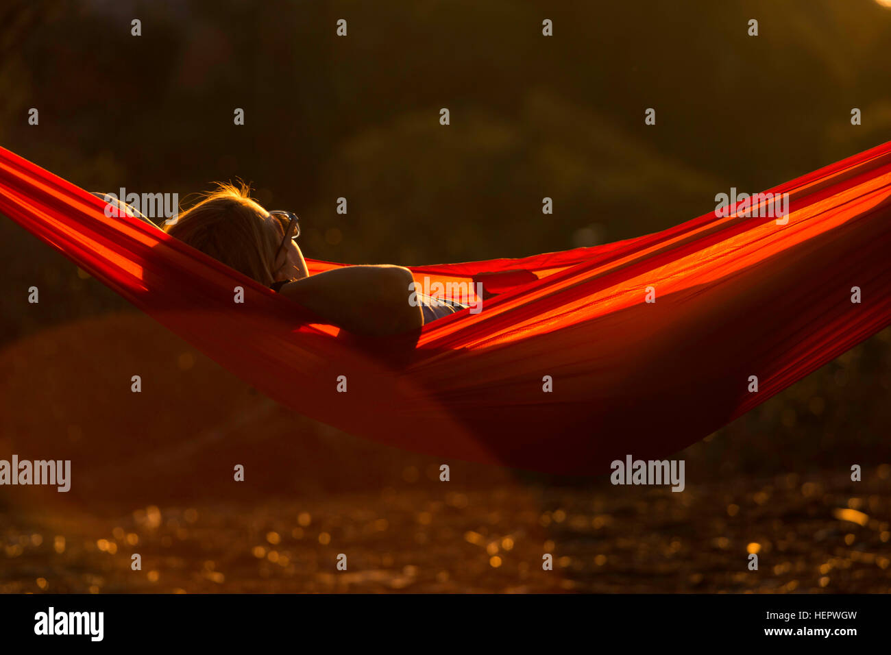 Woman lying in the sun hi-res stock photography and images - Alamy