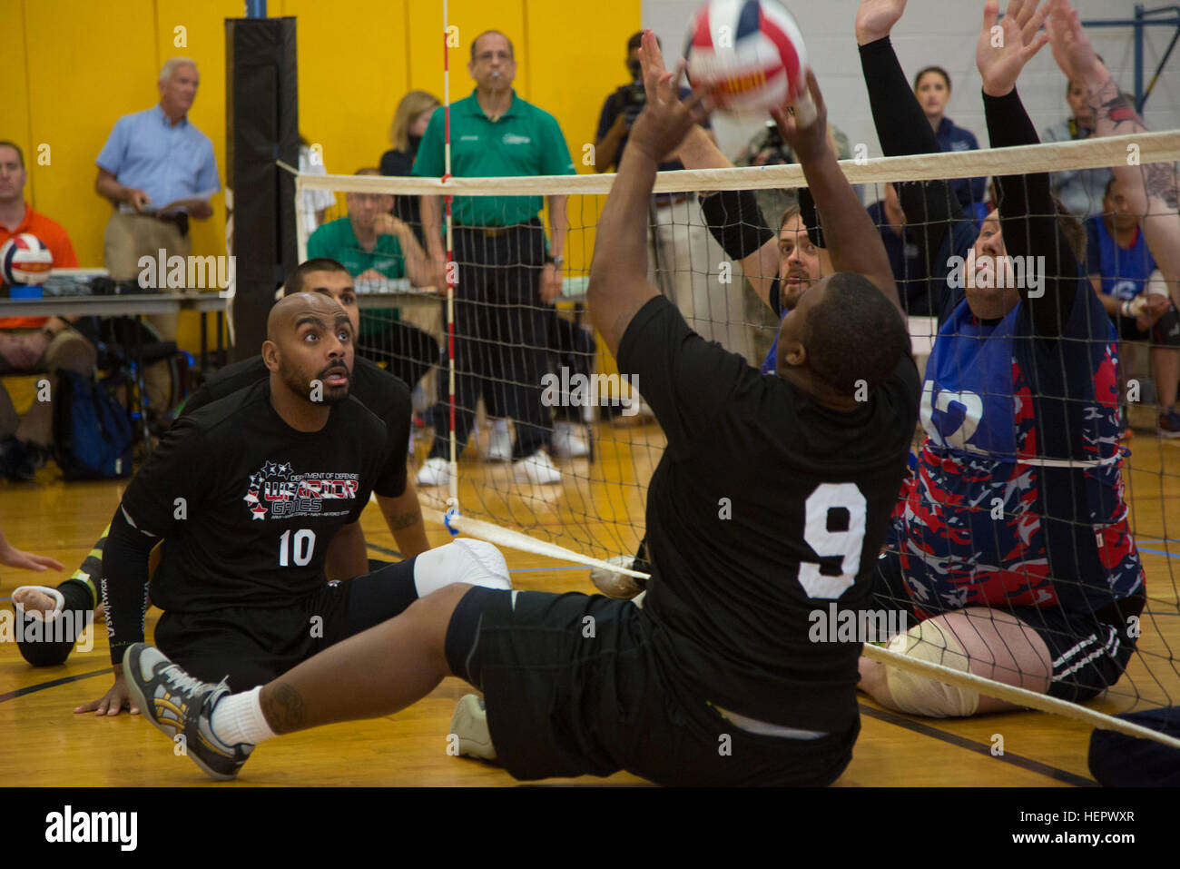 Team Army athletes participate in a sitting volleyball match against ...