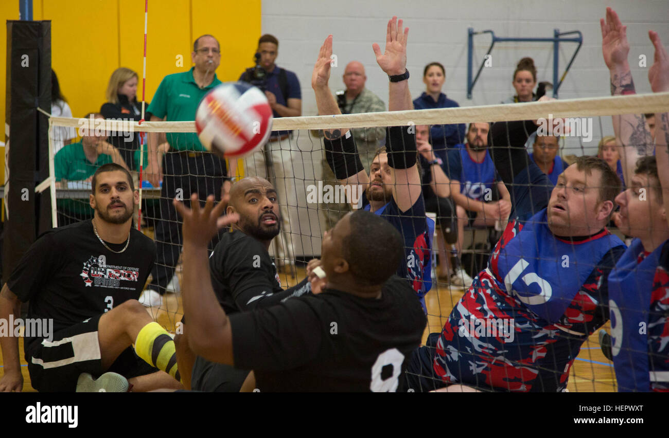 Team Army athletes participate in a sitting volleyball match against ...
