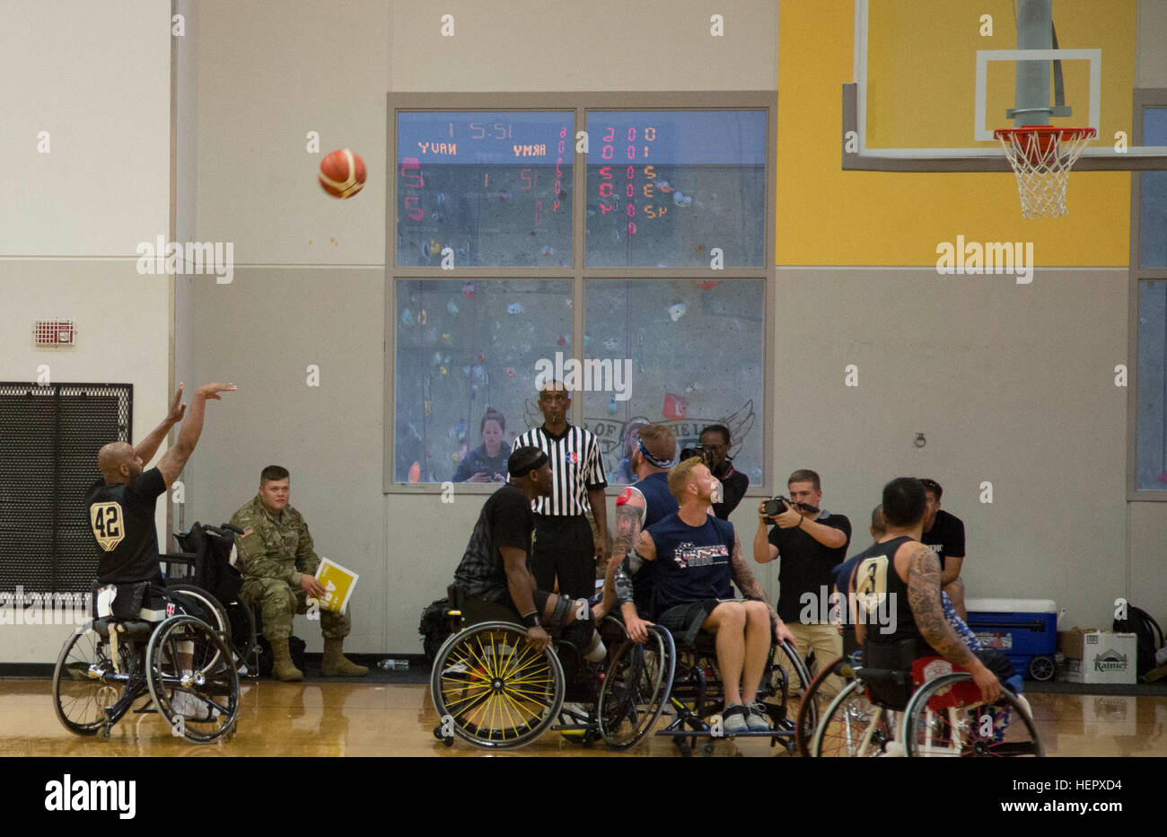 Team Army athletes compete in a wheelchair basketball match during the ...