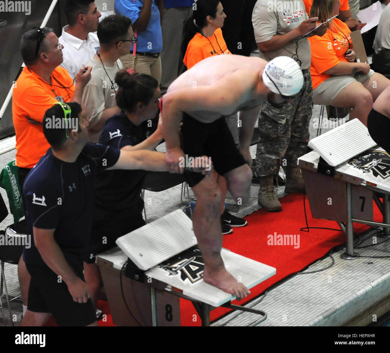 Royal Marine Alex Brewer of Team U.K. gets a little assistance just ...