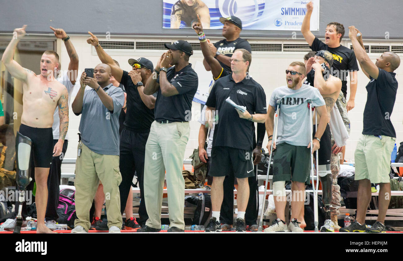 Team Army athletes and coaches cheer for their team members, during the ...