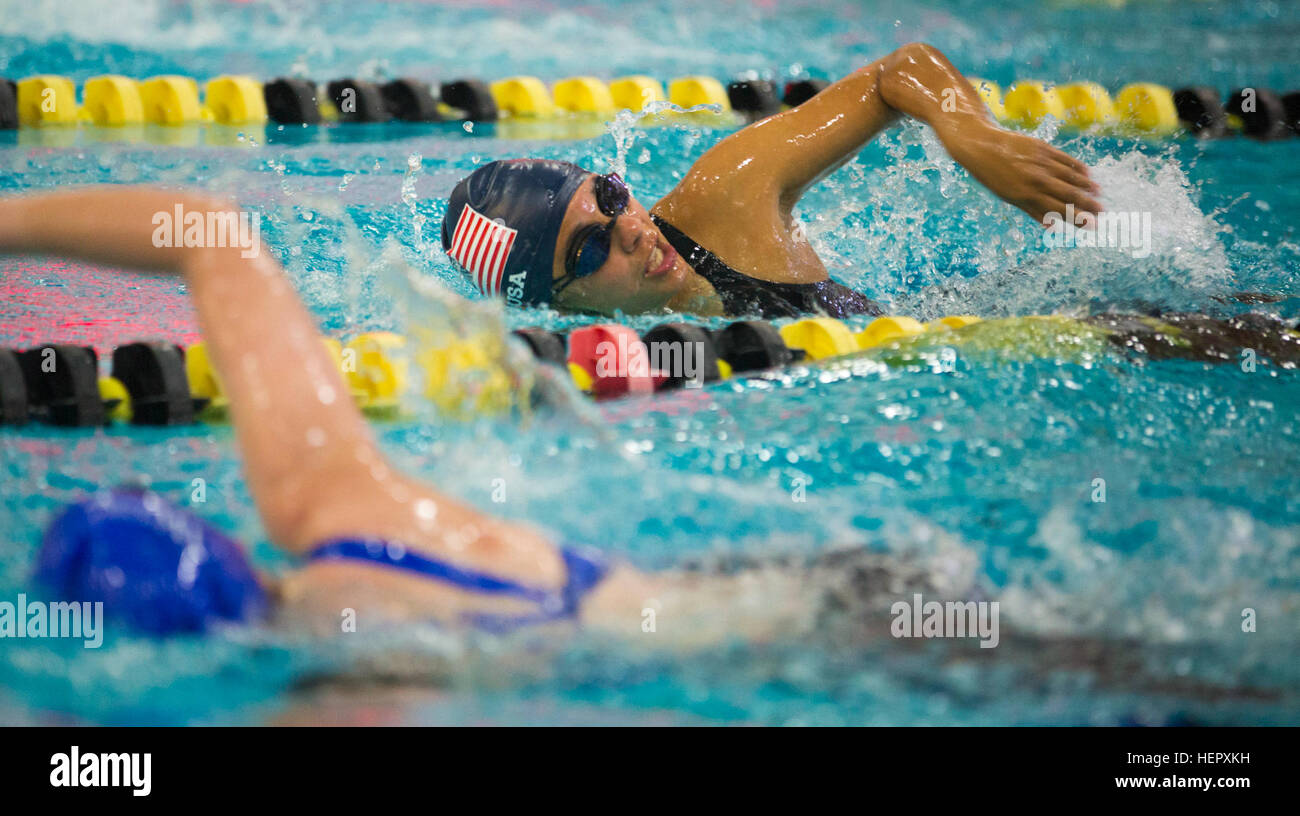 A U.S. Army Veteran competes in the swimming event of the 2016 DoD ...