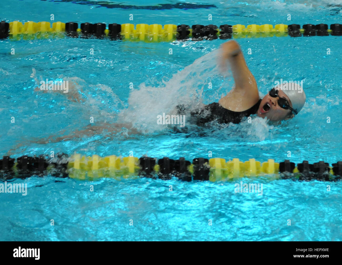 Team SOCOM member Army Spc. Kim Ong powers through the water during the ...
