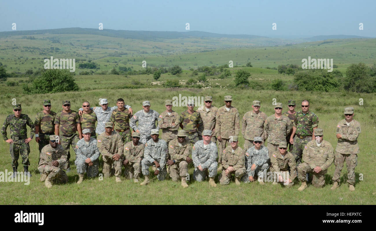Alabama National Guardsmen and Romanian Land Forces Soldiers pose for a ...