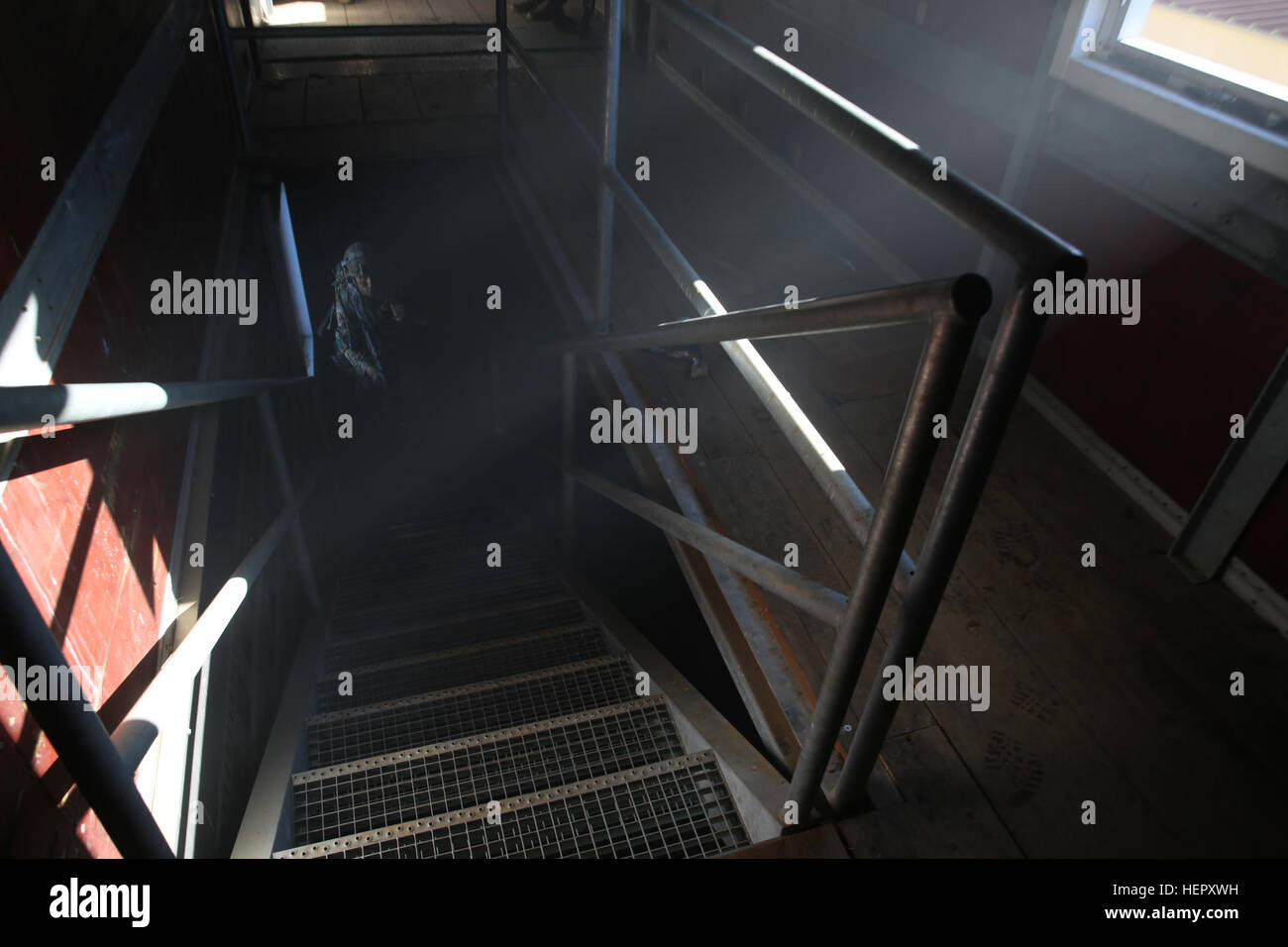 A British soldier of the 3rd Battalion, Parachute Regiment clears a ...