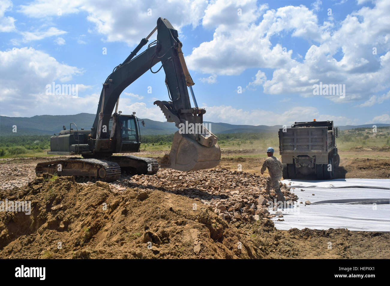 A U.S. Army engineer from the 168th Engineer Brigade oversees the ...