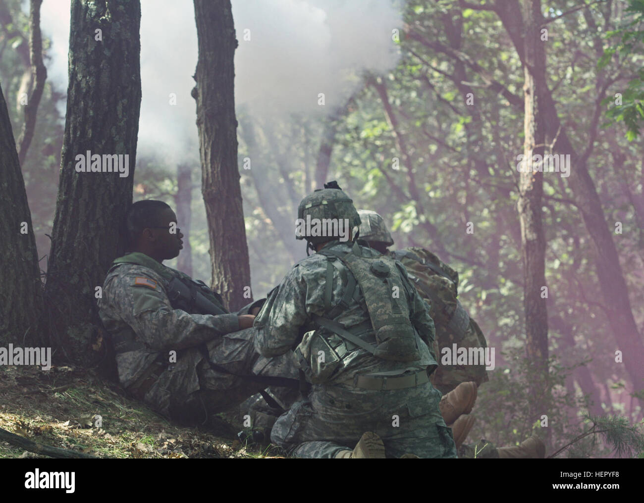 Two U.S. Army Reserve Soldiers rush to the aid of an "injured" Soldier ...