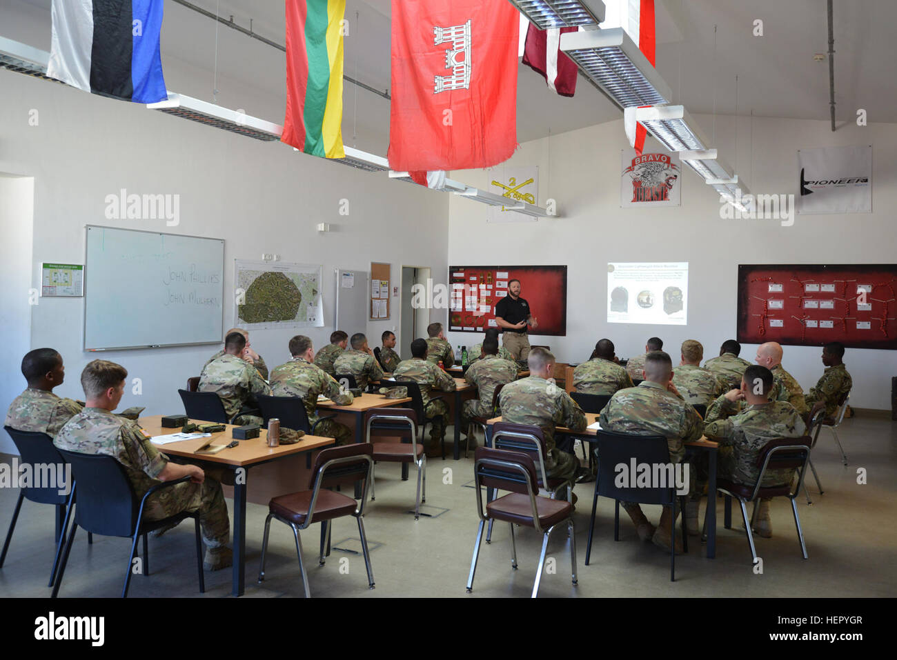 John Phillips, standing, a New Equipment Training Instructor, gives a ...