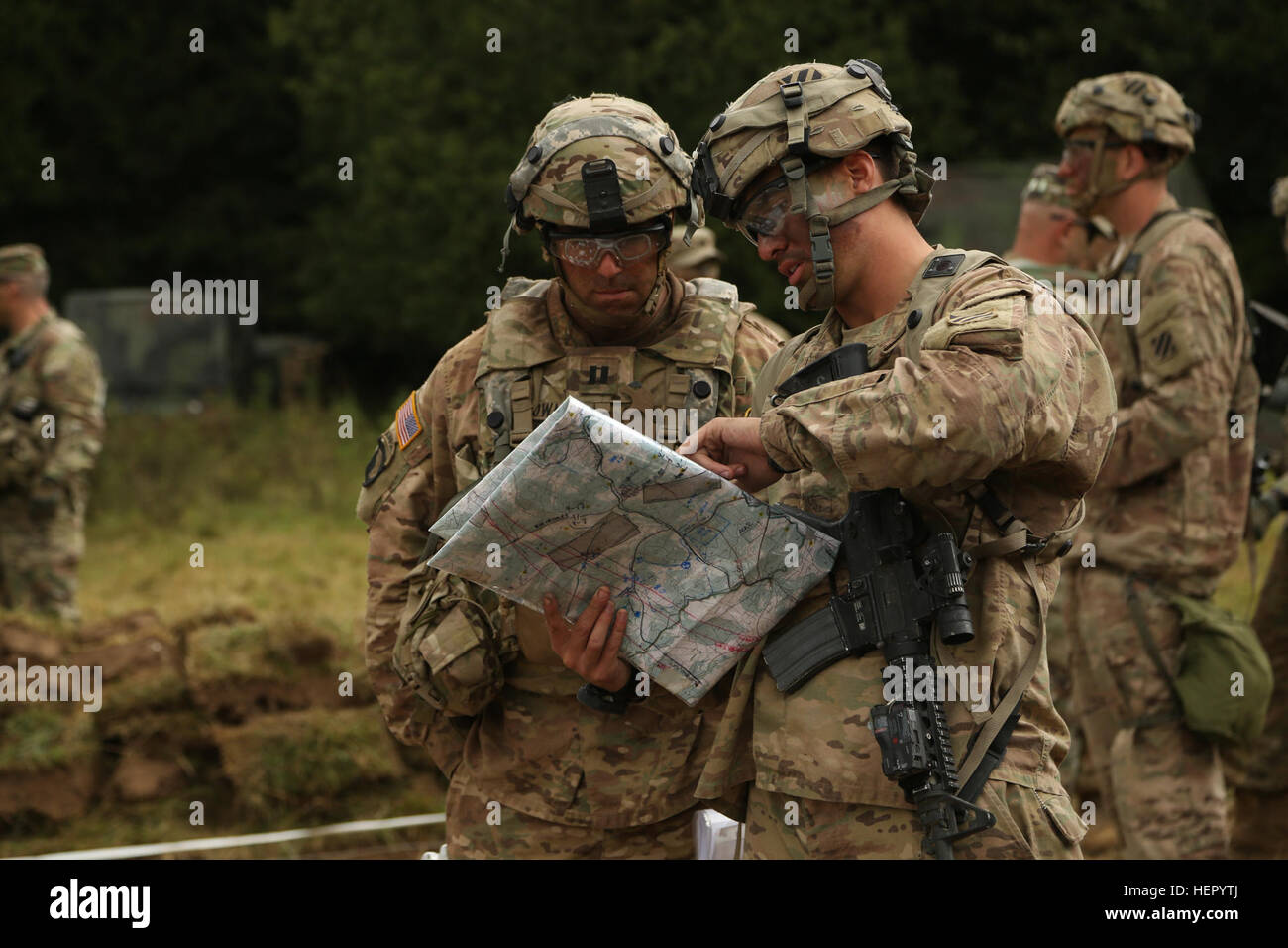 U.S. Soldiers of the 3rd Infantry Division point at a map prior to ...