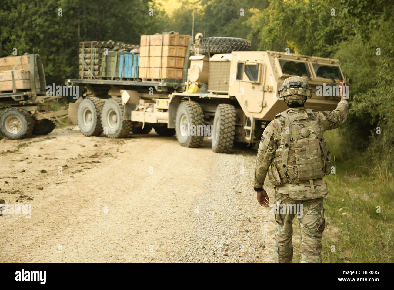 A U.S. Army Soldier guides an M984A4 recovery truck during a resupply ...