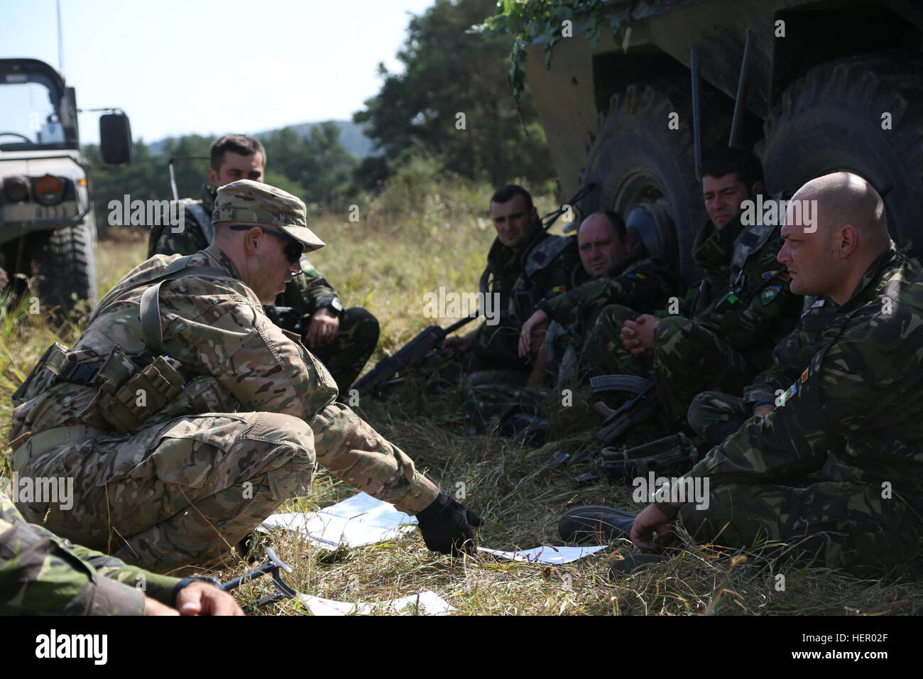 U.S. Army Capt. Marcus Smith, left, of Warhog Observer Coach Trainer ...