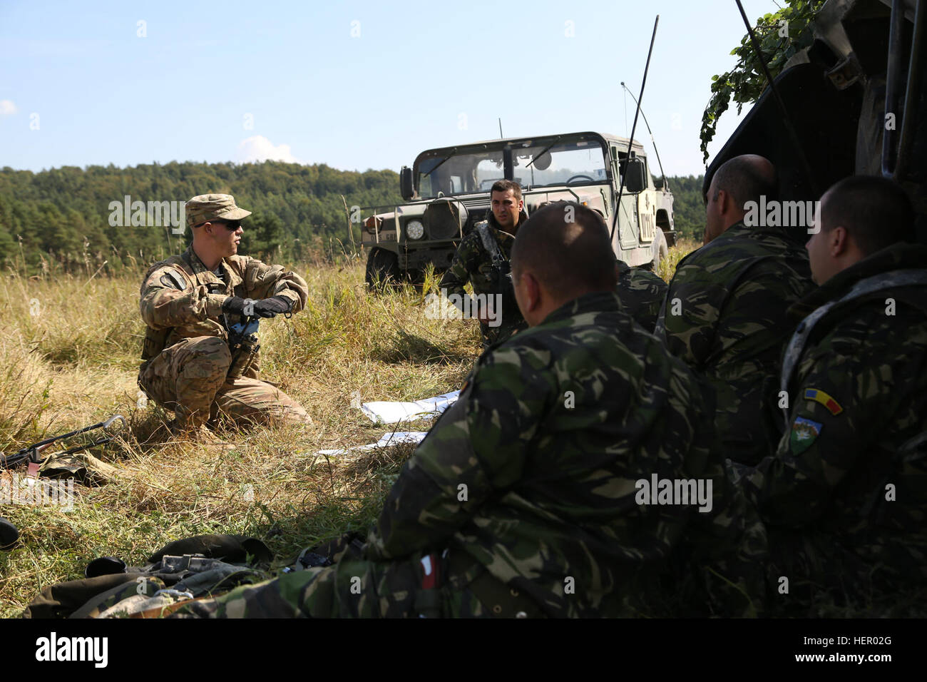 U.S. Army Capt. Marcus Smith, left, of Warhog Observer Coach Trainer ...
