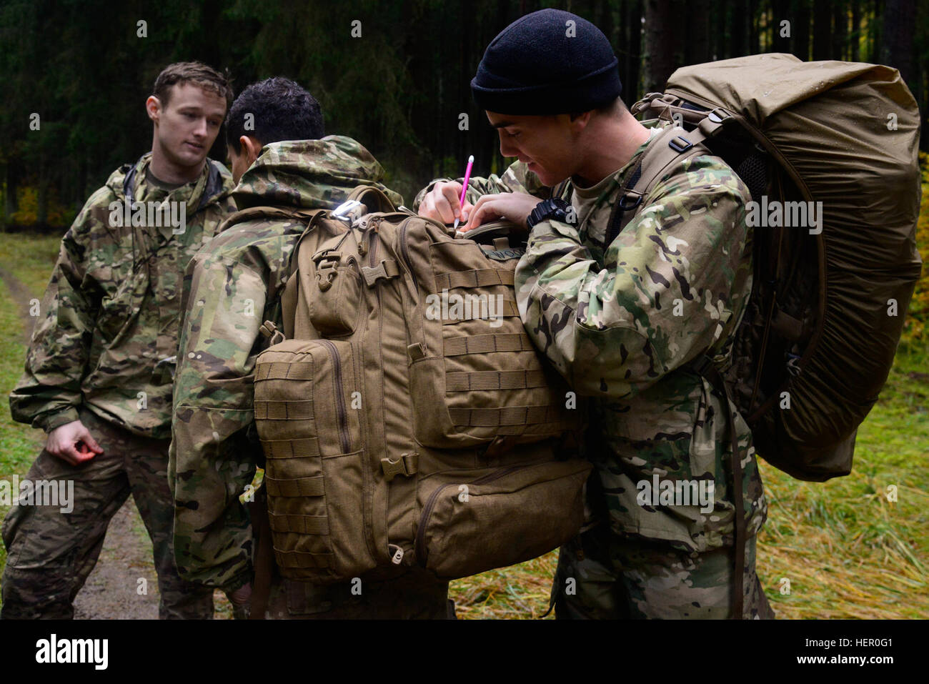 U.S. Soldiers, assigned to the 173rd Airborne Brigade, plot points on a ...