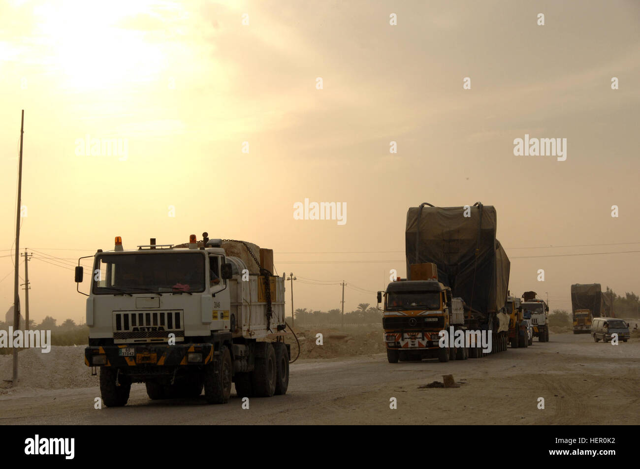 Vehicles carrying sections of a massive generator enter Baghdad, Iraq ...