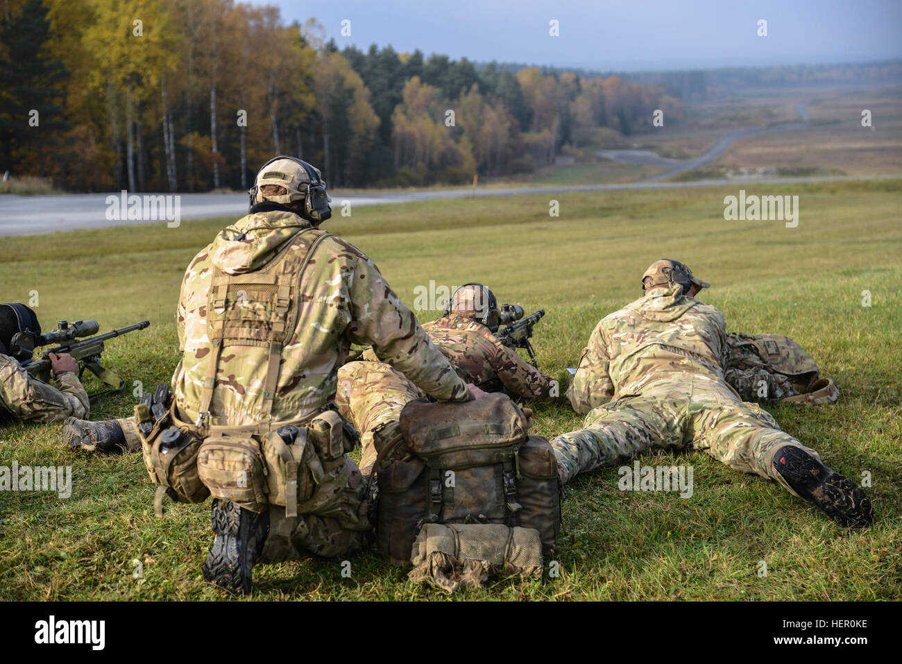 British soldiers work together to engage the target during the Day Shot ...