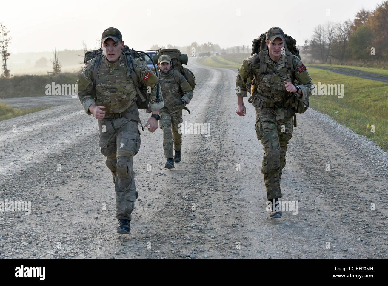 Danish soldiers participate in the 12 mile Ruck March event as part of ...