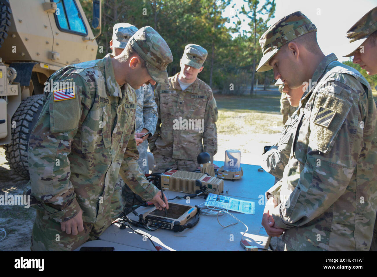 Staff Sgt. Christopher Krueger (left), an intelligence analyst assigned ...