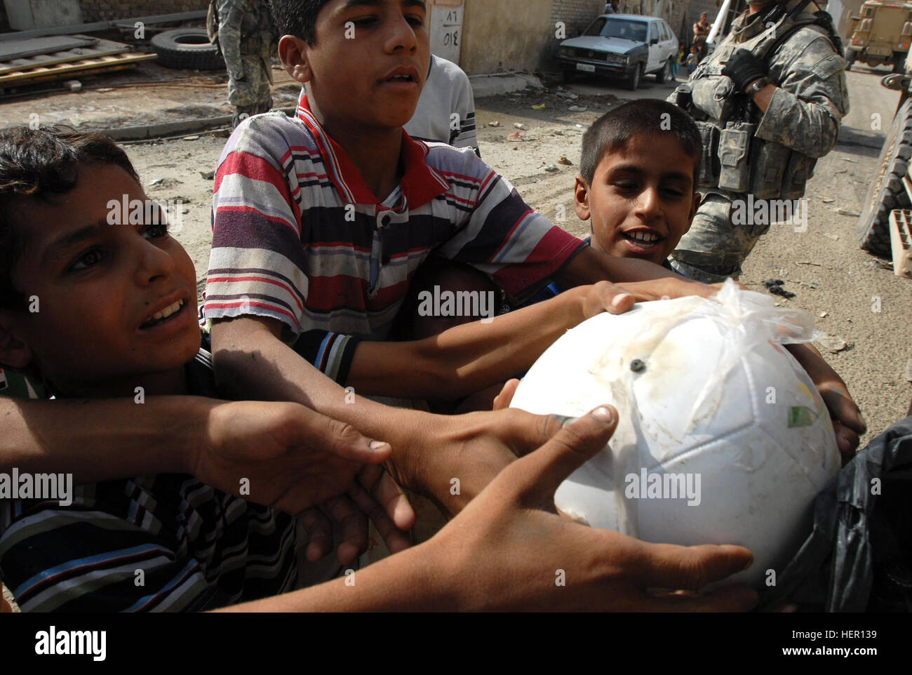 Iraqi children receive soccer balls, candy, and cookies from U.S. Army ...