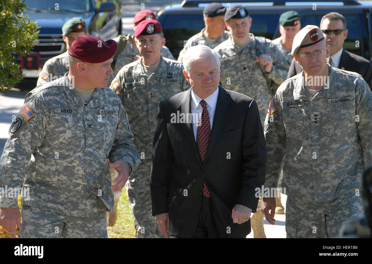 Secretary of Defense Robert Gates (middle) speaks with Lt. Gen. Robert ...