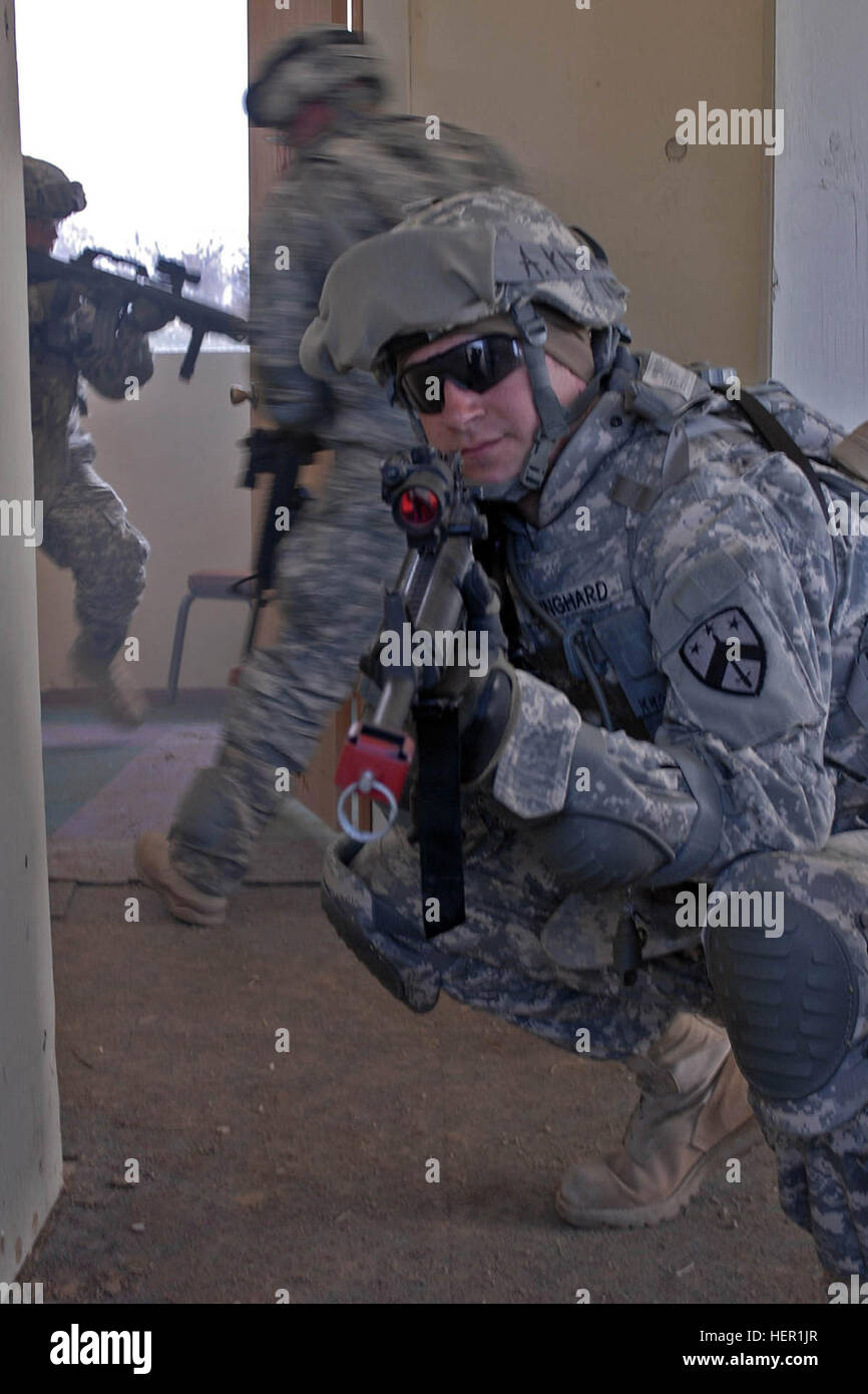 Spc. Aaron Klinghard pulls rear security as his Soldiers from his squad ...