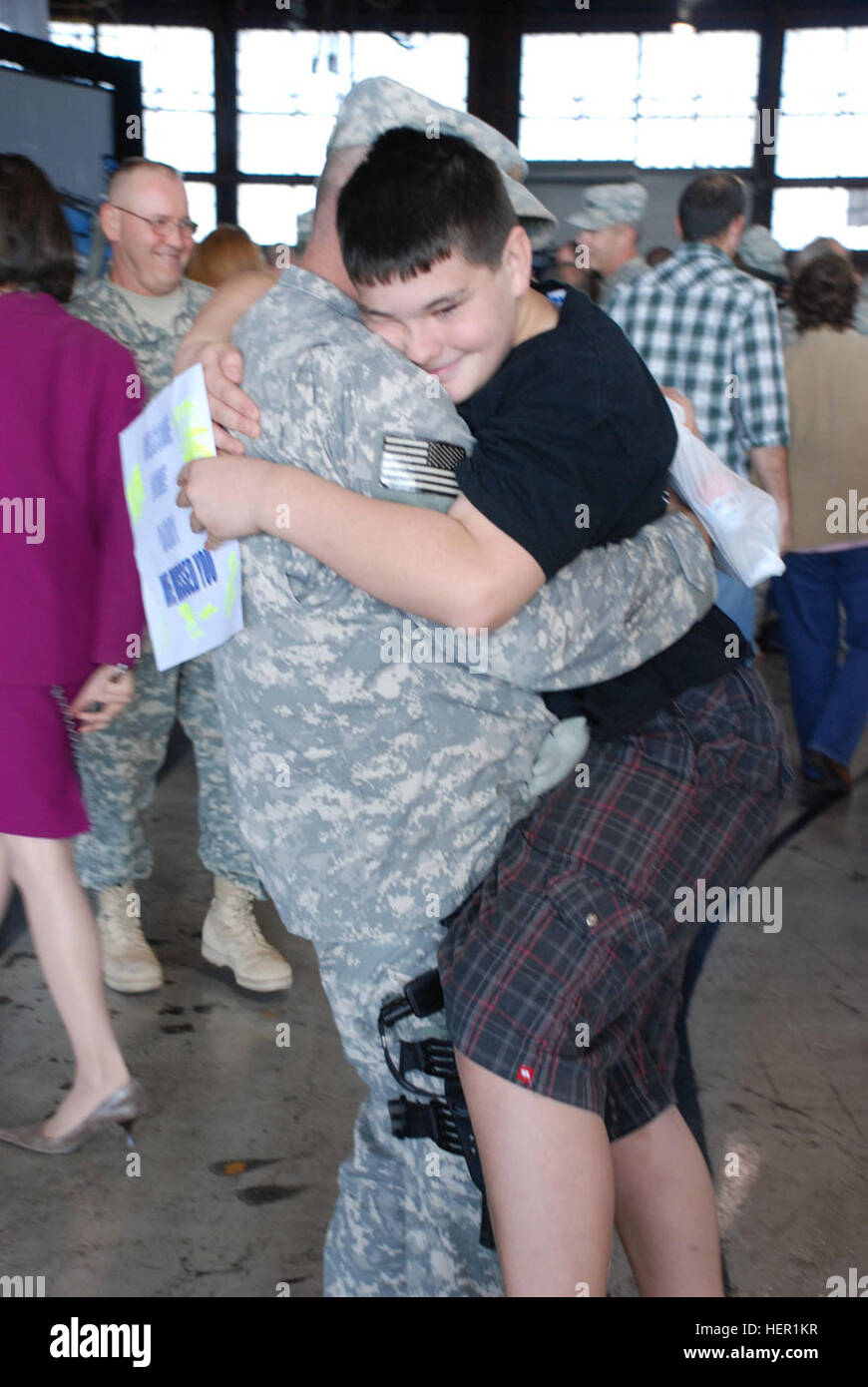Indiana National Guard Maj. David L. Mathieu embraces his son, Andrew ...