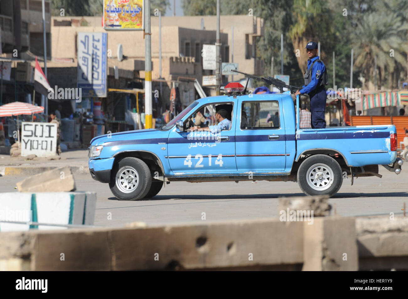 Iraqi National Police patrol near a mosque in central Salman Pak, Iraq ...