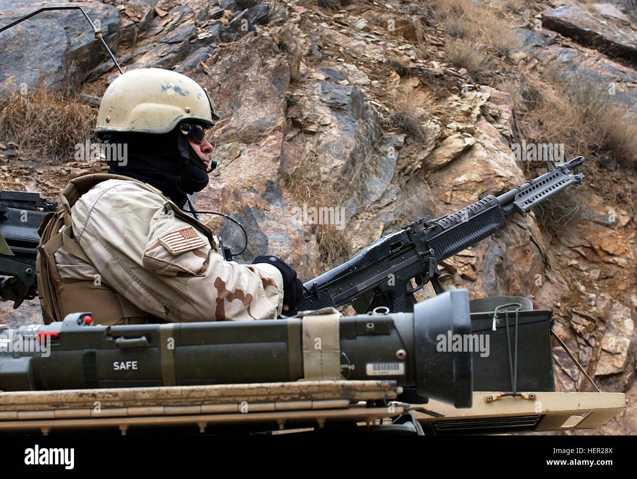 A U.S. Army Special Forces soldier operates an M-60 machine gun in a ...