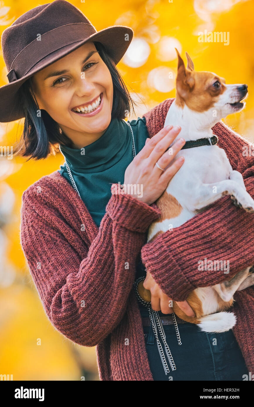 happy young woman dog outdoors in autumn Stock Photo - Alamy
