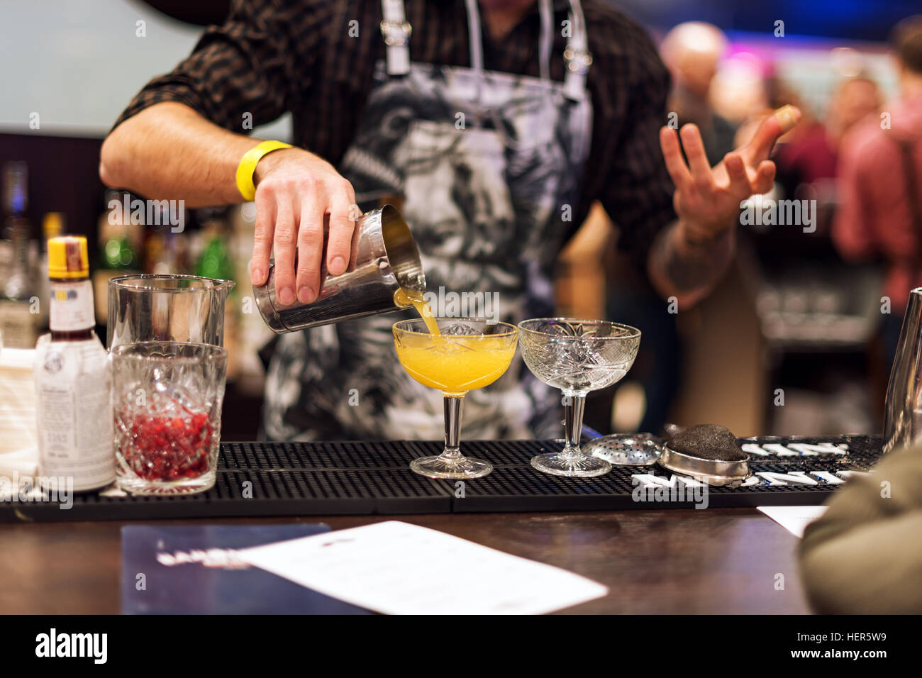 Barman show. Bartender is making cocktail at night club Stock Photo - Alamy