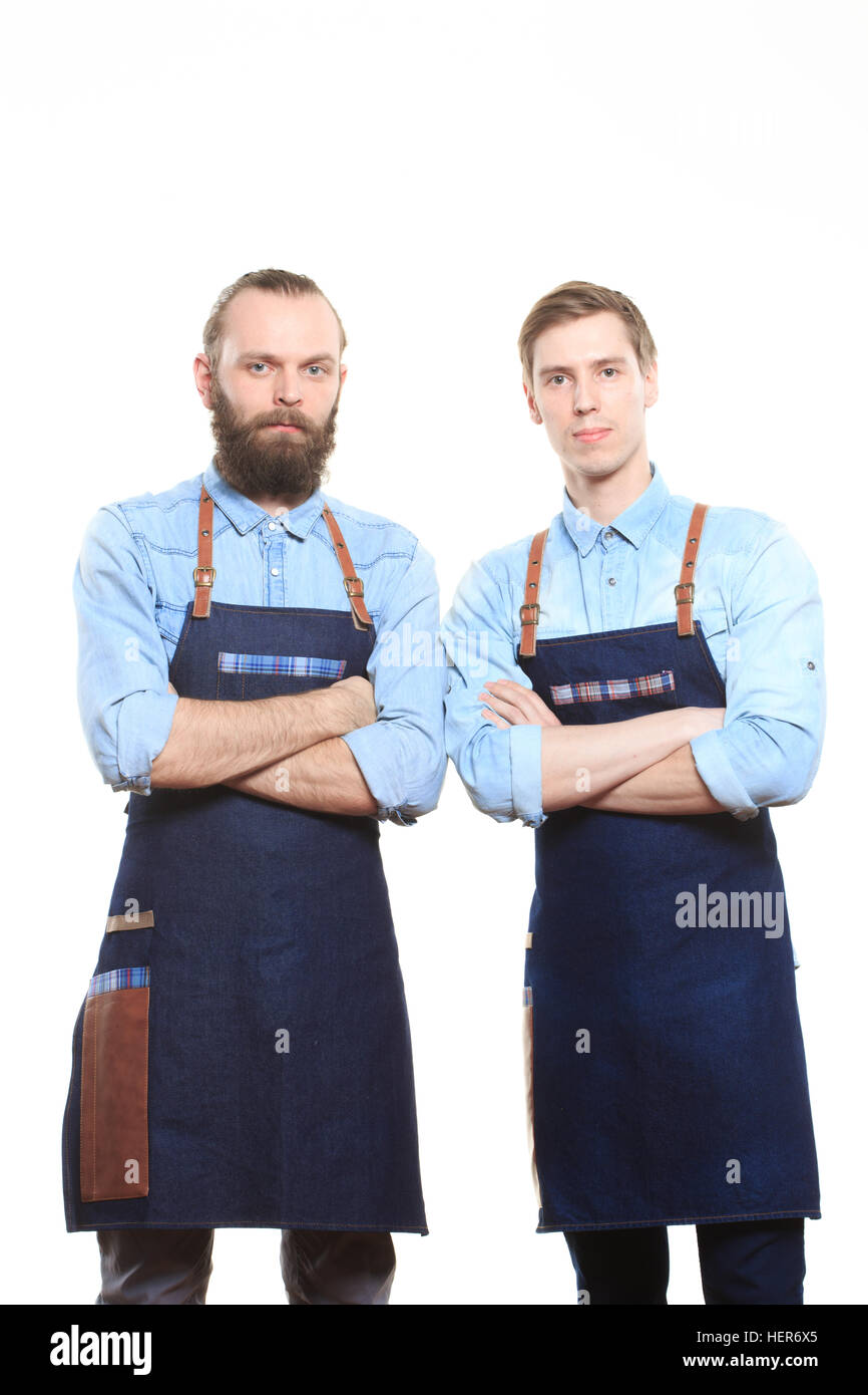 two bartender on white background. behind the bar Stock Photo - Alamy