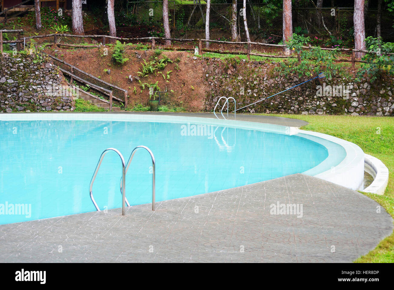Swimming pool in the middle of a natural forest Stock Photo - Alamy