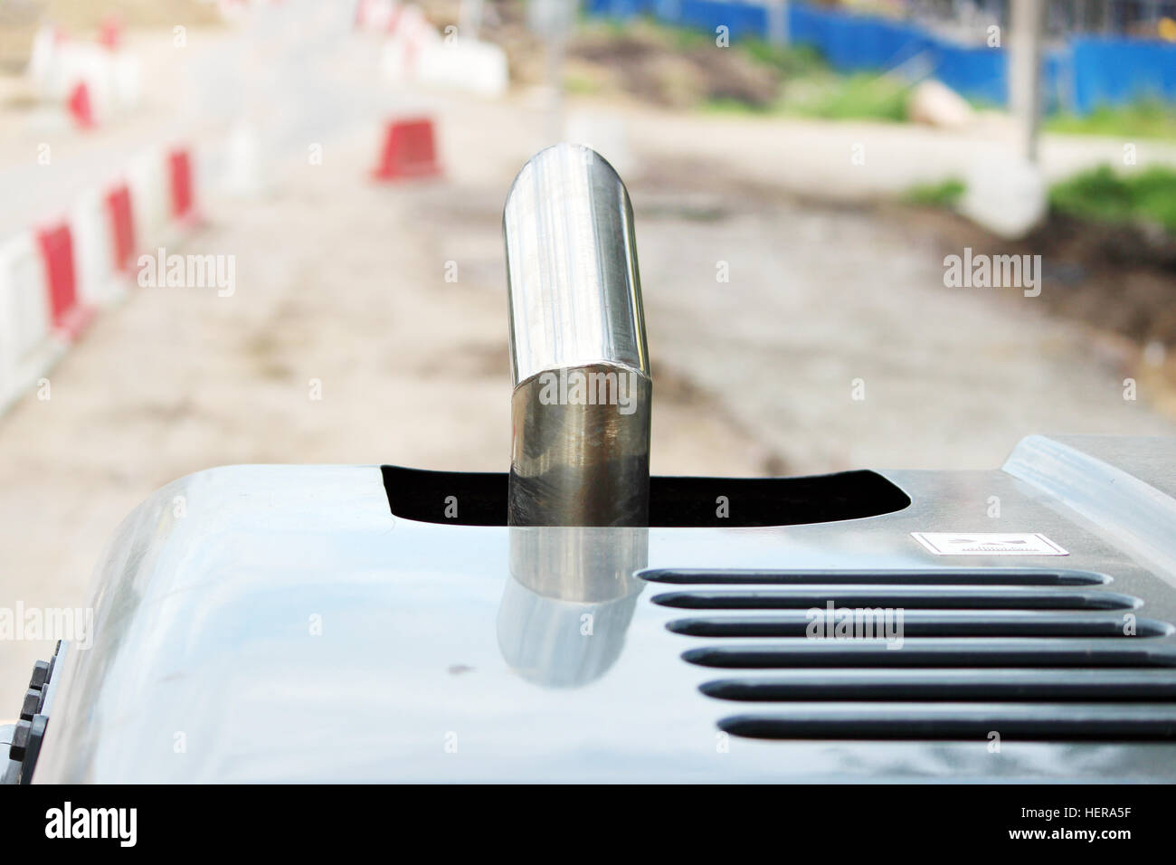 Exhausting metal pipe of a tractor in the construction of road Stock ...