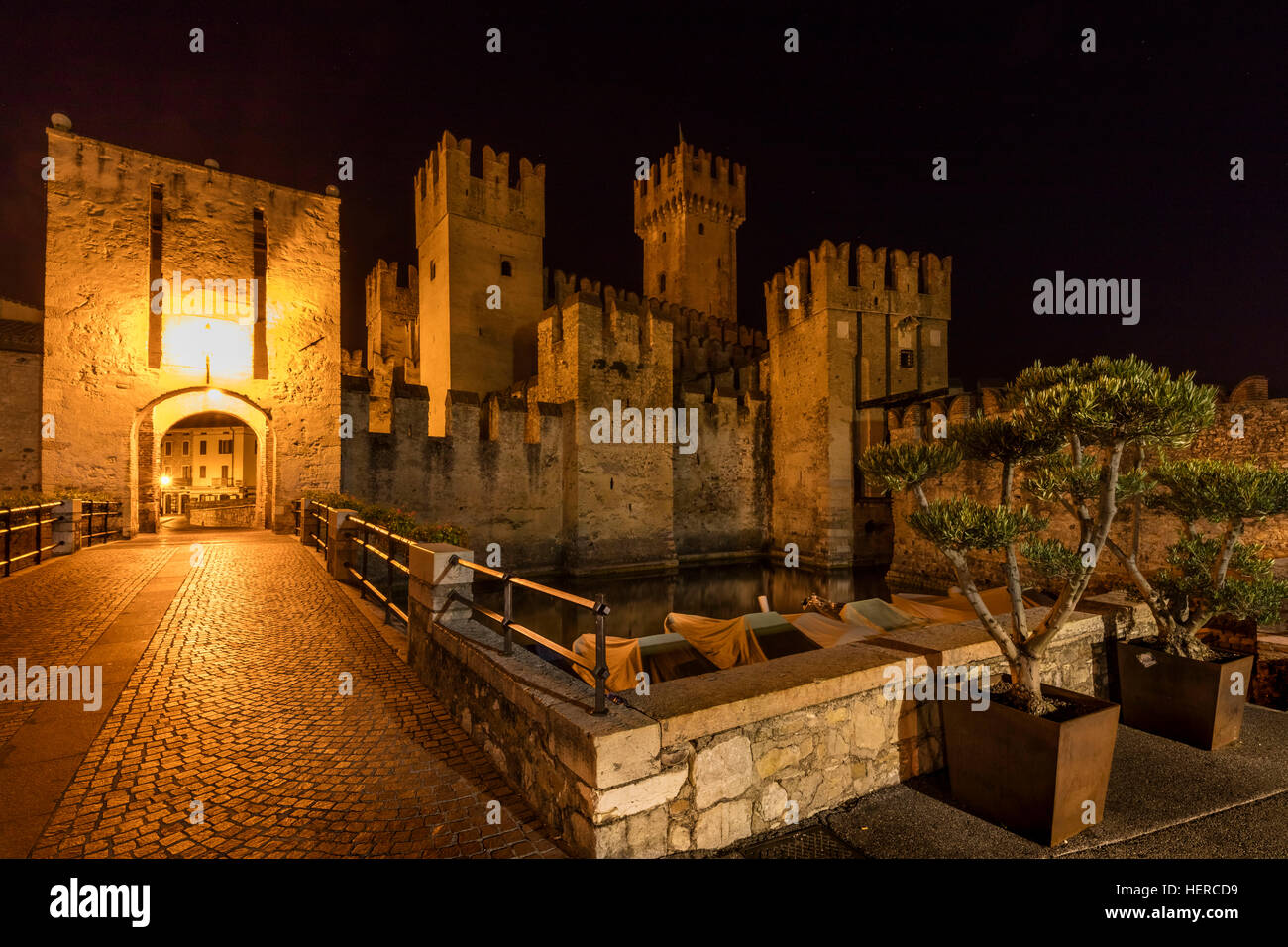 View to the Castello Scaligero before sunrise, drawbridge, entry, moat ...