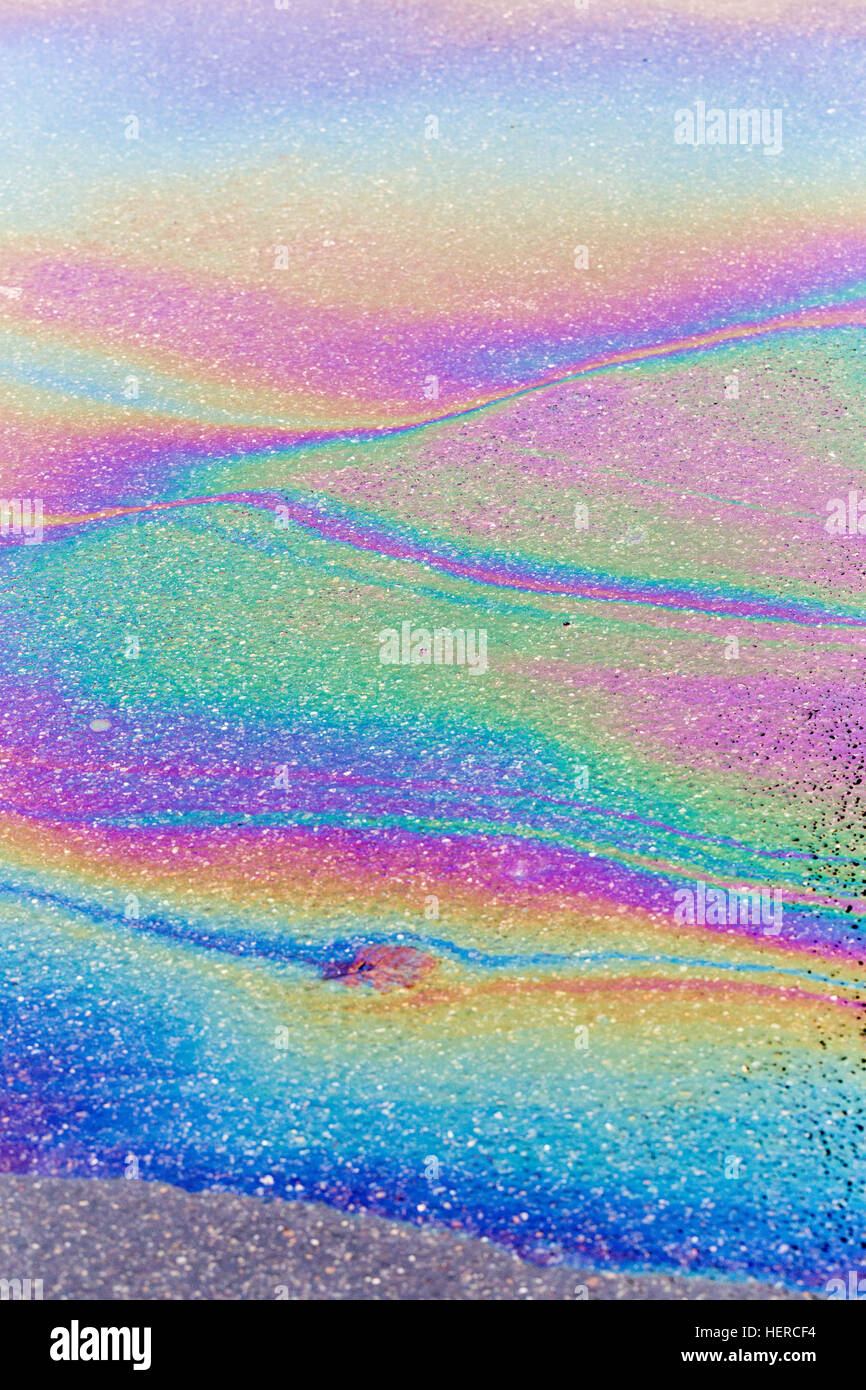 Oil streaks on wet asphalt Stock Photo - Alamy