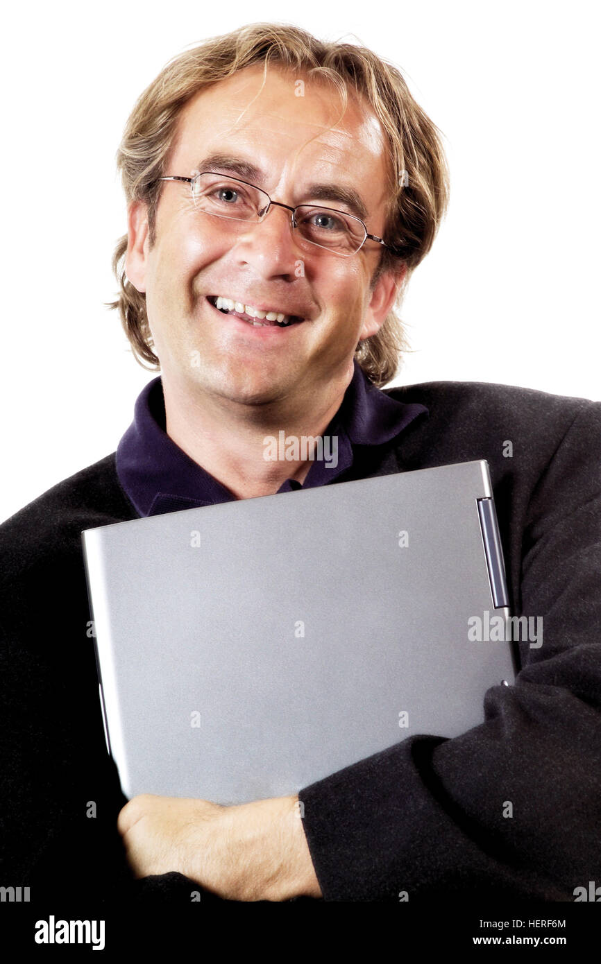 Man holding laptop under arm hi-res stock photography and images - Alamy