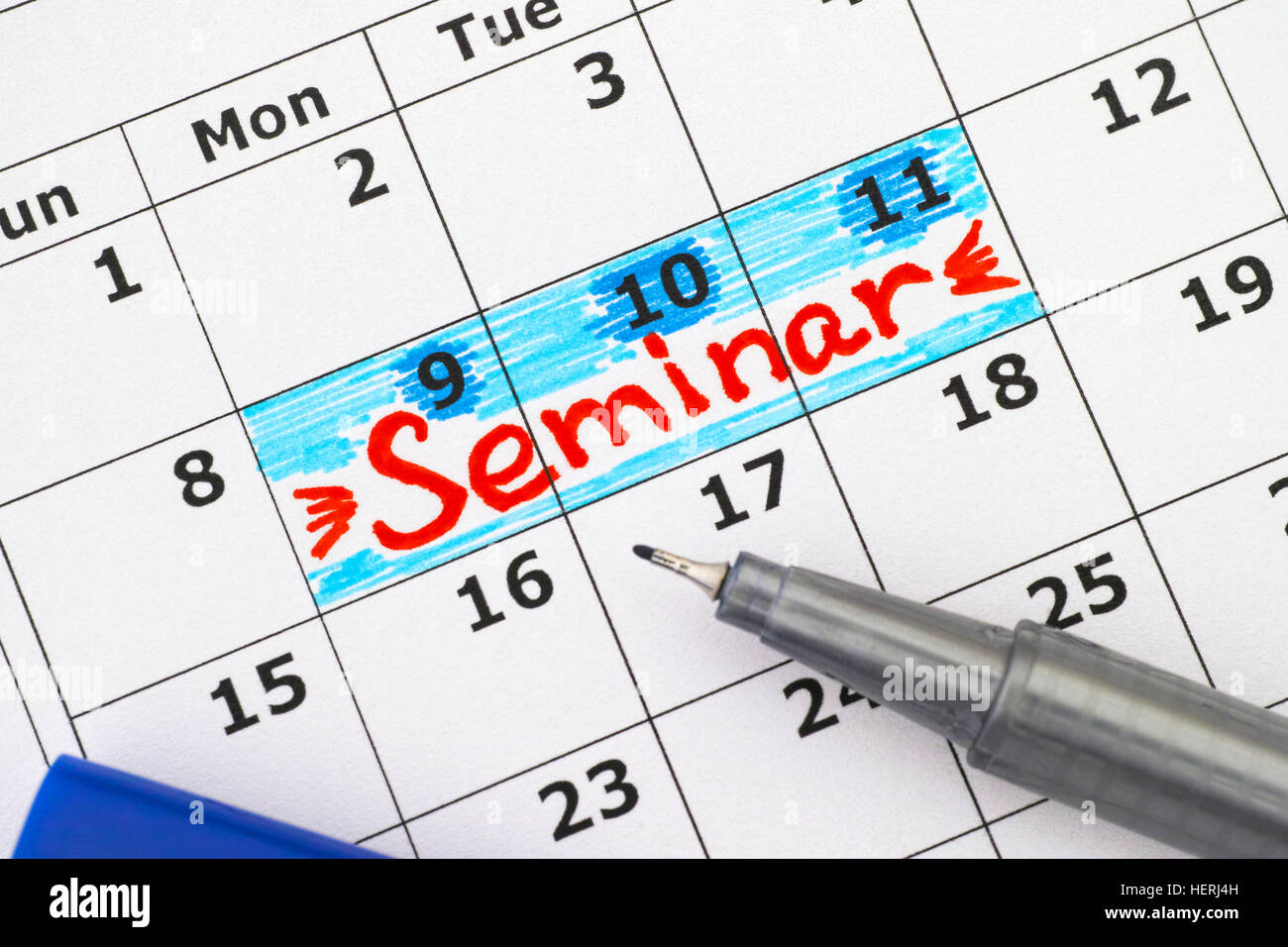 Reminder Seminar in calendar with blue pen. Focus on calendar Stock ...
