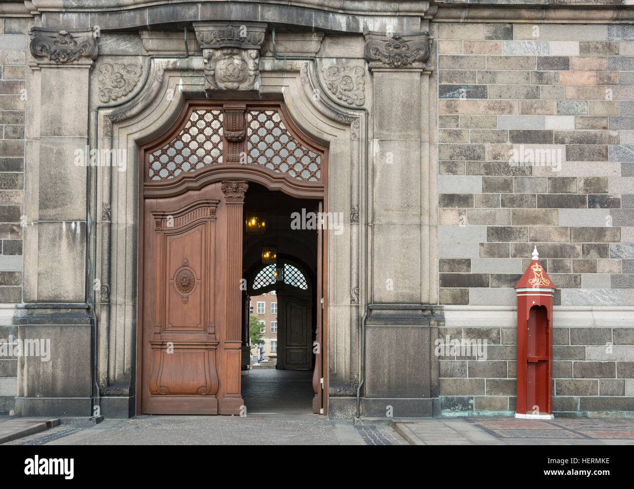 Entrance way into the Christianborg Palace with red sentry box next to ...