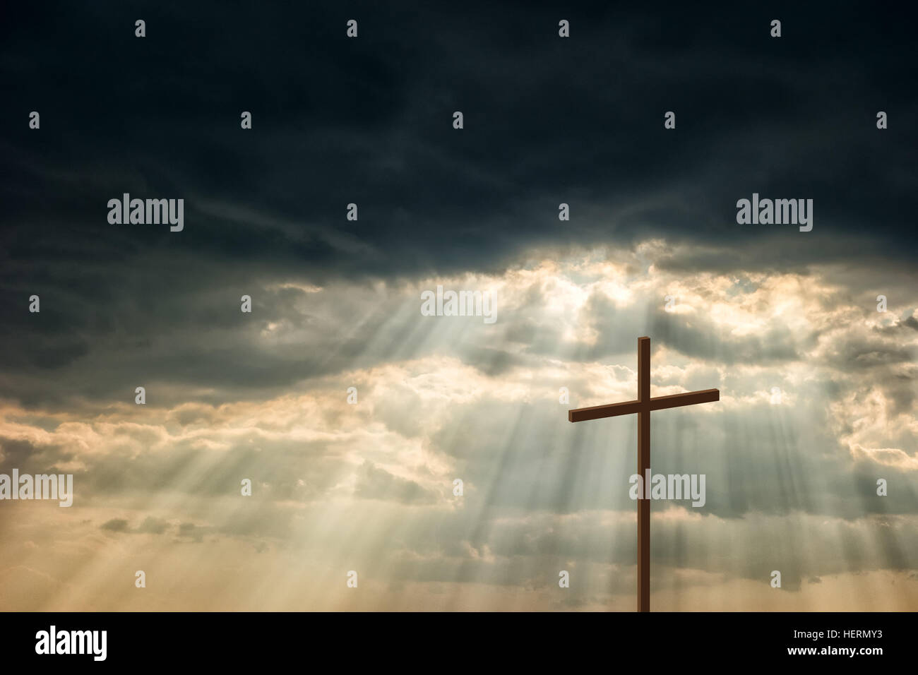 Wooden cross stand against a dramatic evening sky with radiant beams ...
