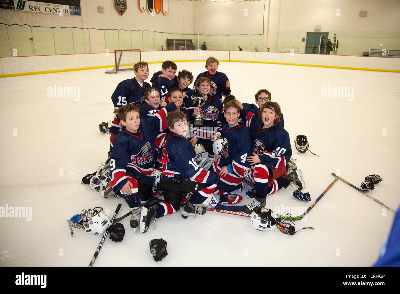 Portrait of boys hockey team trying to look happy after winning the ...