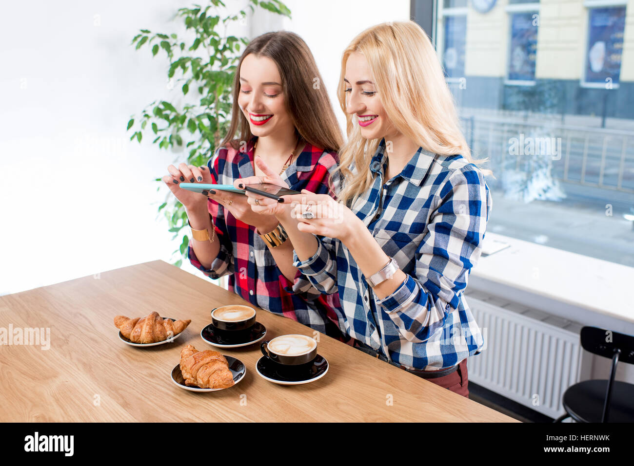 Friends photographing coffee Stock Photo - Alamy