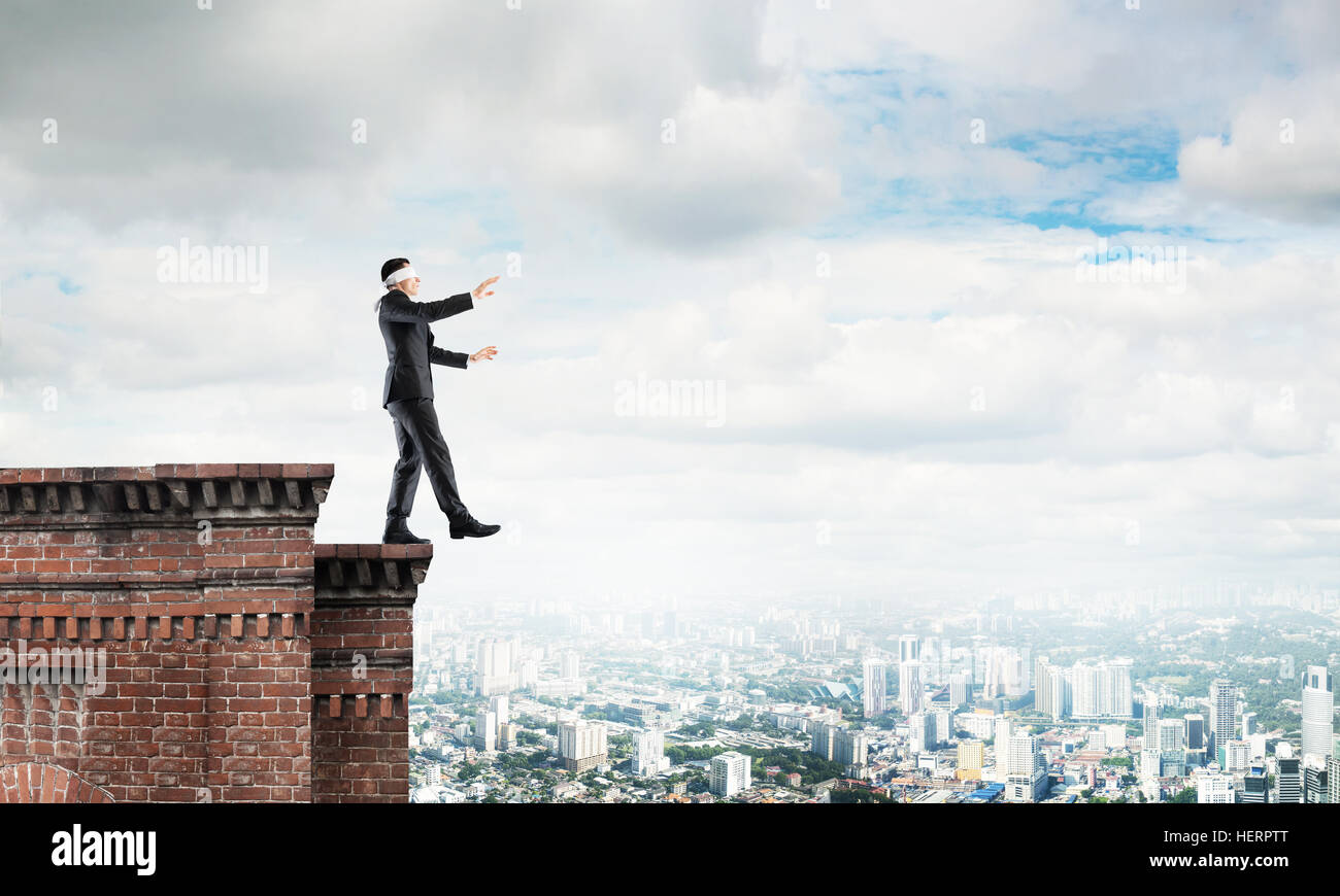 Danger and risk concept with businessman making step from edge Stock ...