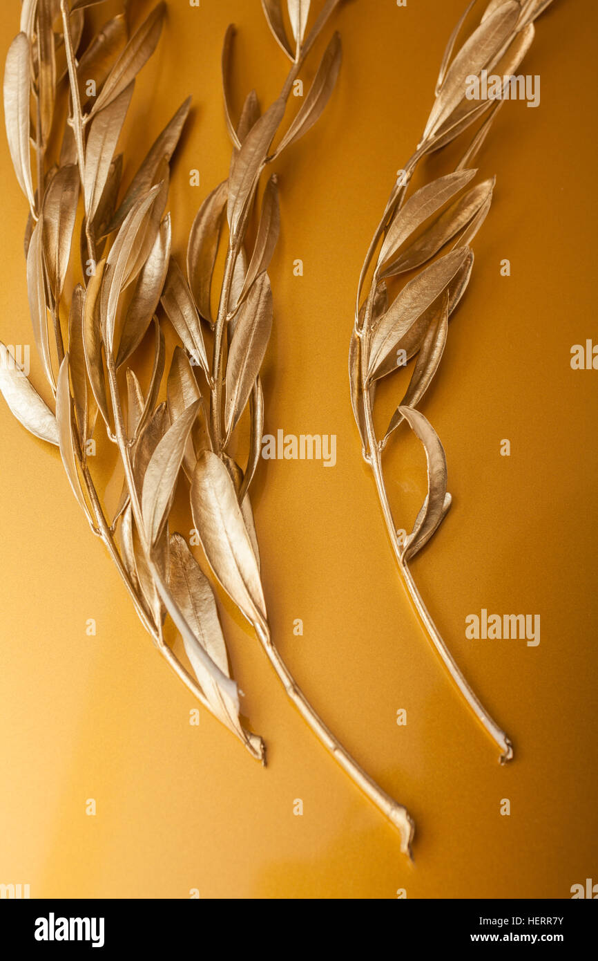 Golden branches of olive tree on golden background Stock Photo - Alamy