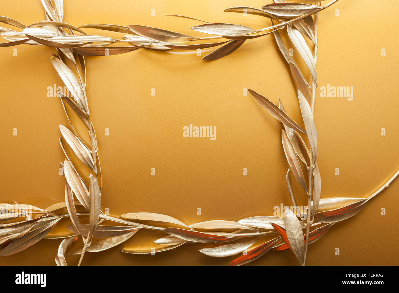 Golden branches of olive tree on golden background Stock Photo - Alamy