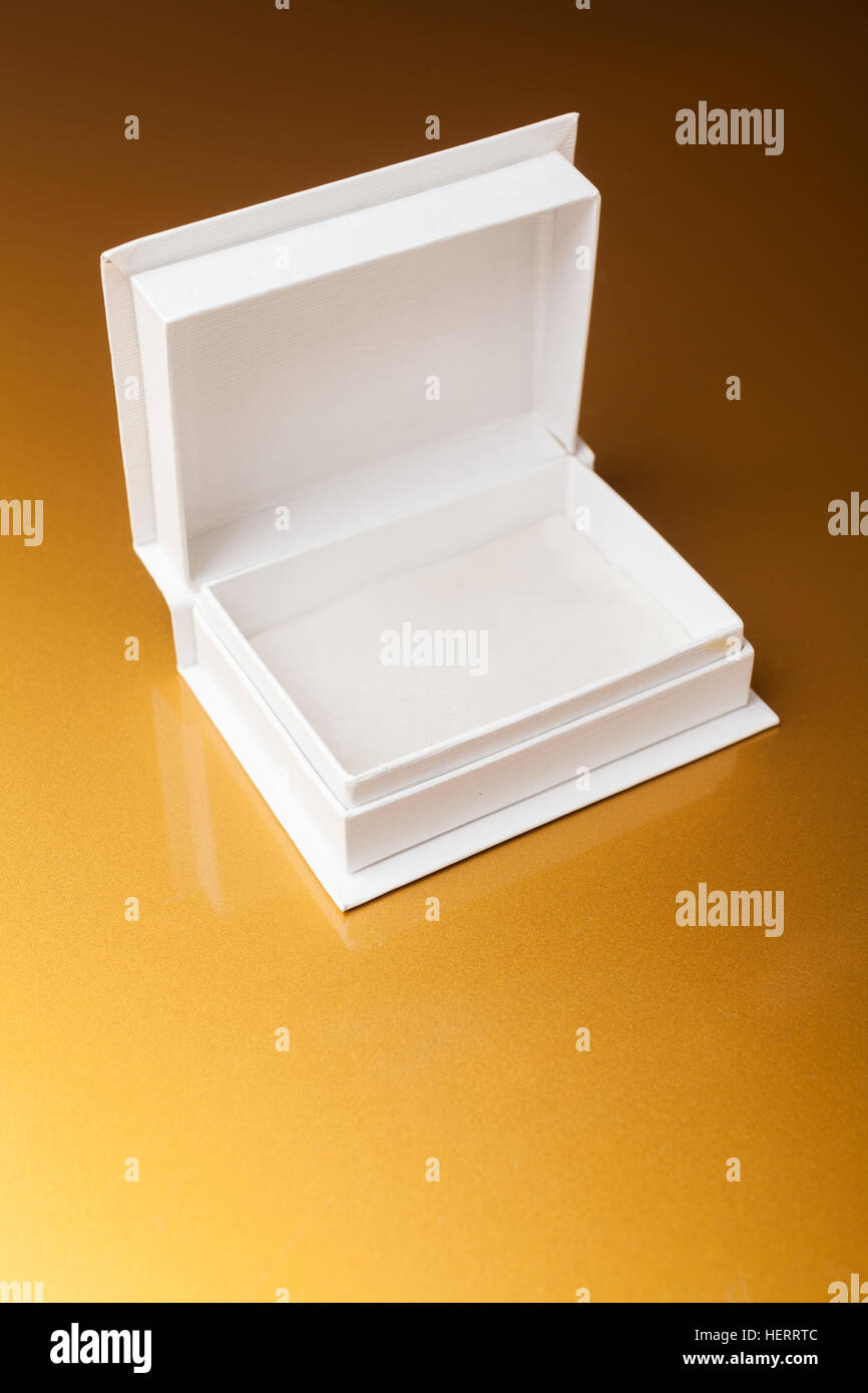 White open box on golden background Stock Photo - Alamy